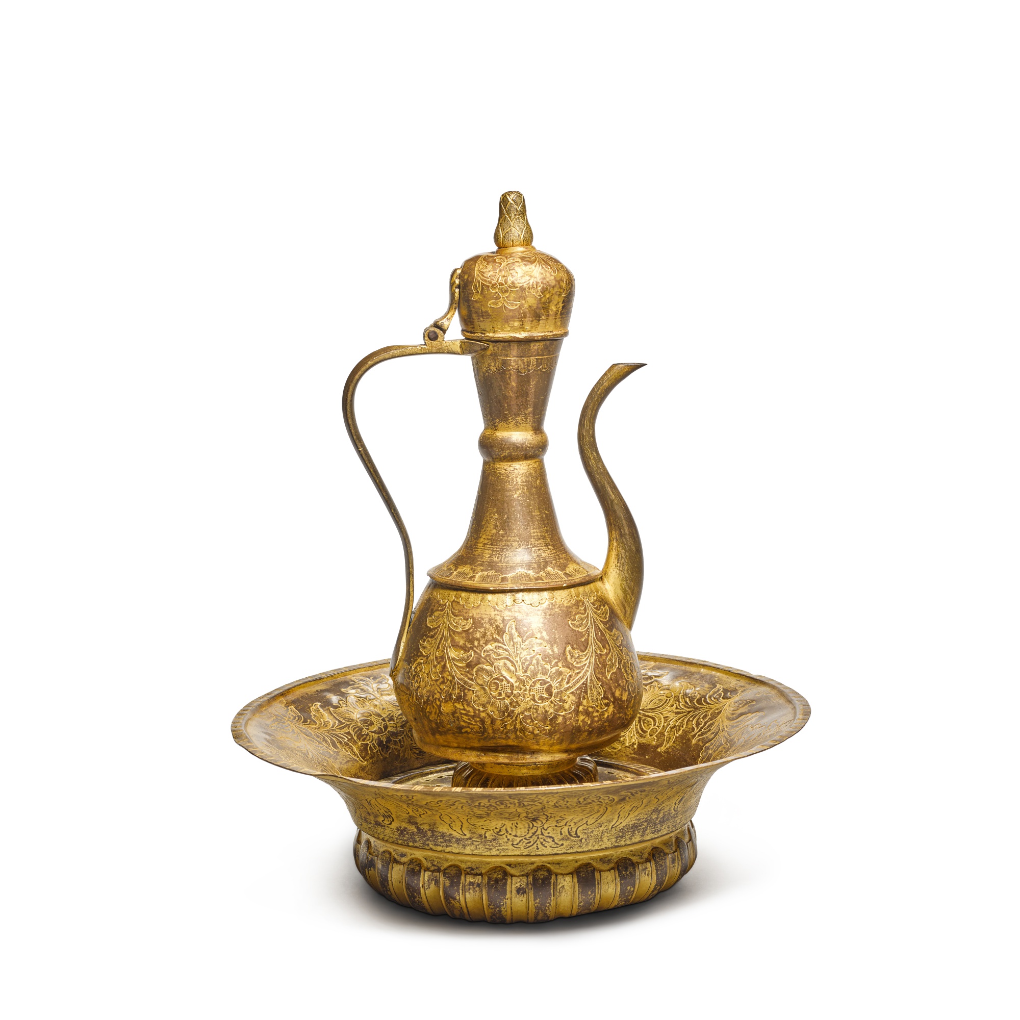 An Ottoman gilt-copper (tombak) lidded ewer, with associated basin and ...