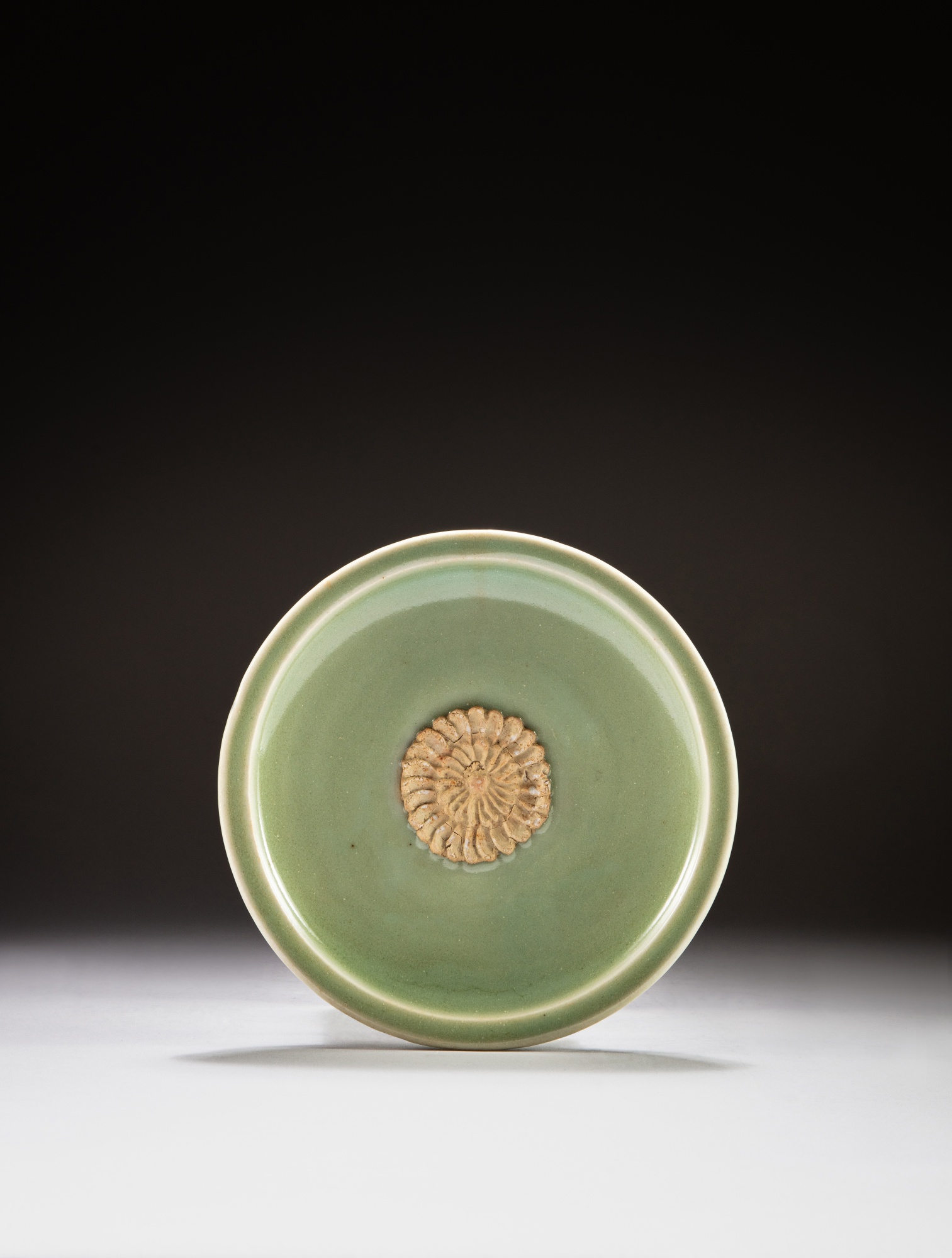 A 'Longquan' celadon-glazed and biscuit-decorated dish, Yuan dynasty ...