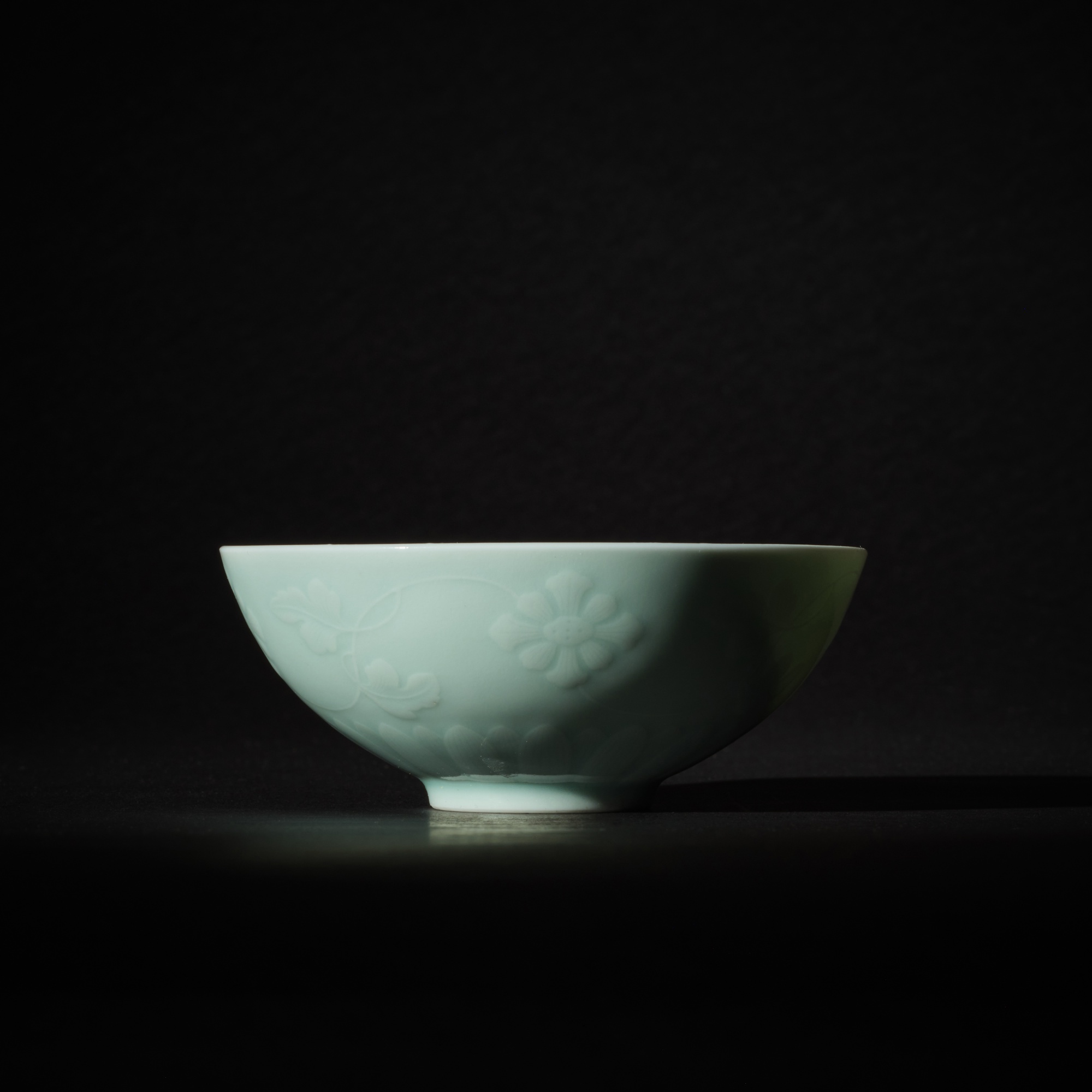 A fine molded celadon-glazed 'floral' bowl, Mark and period of ...
