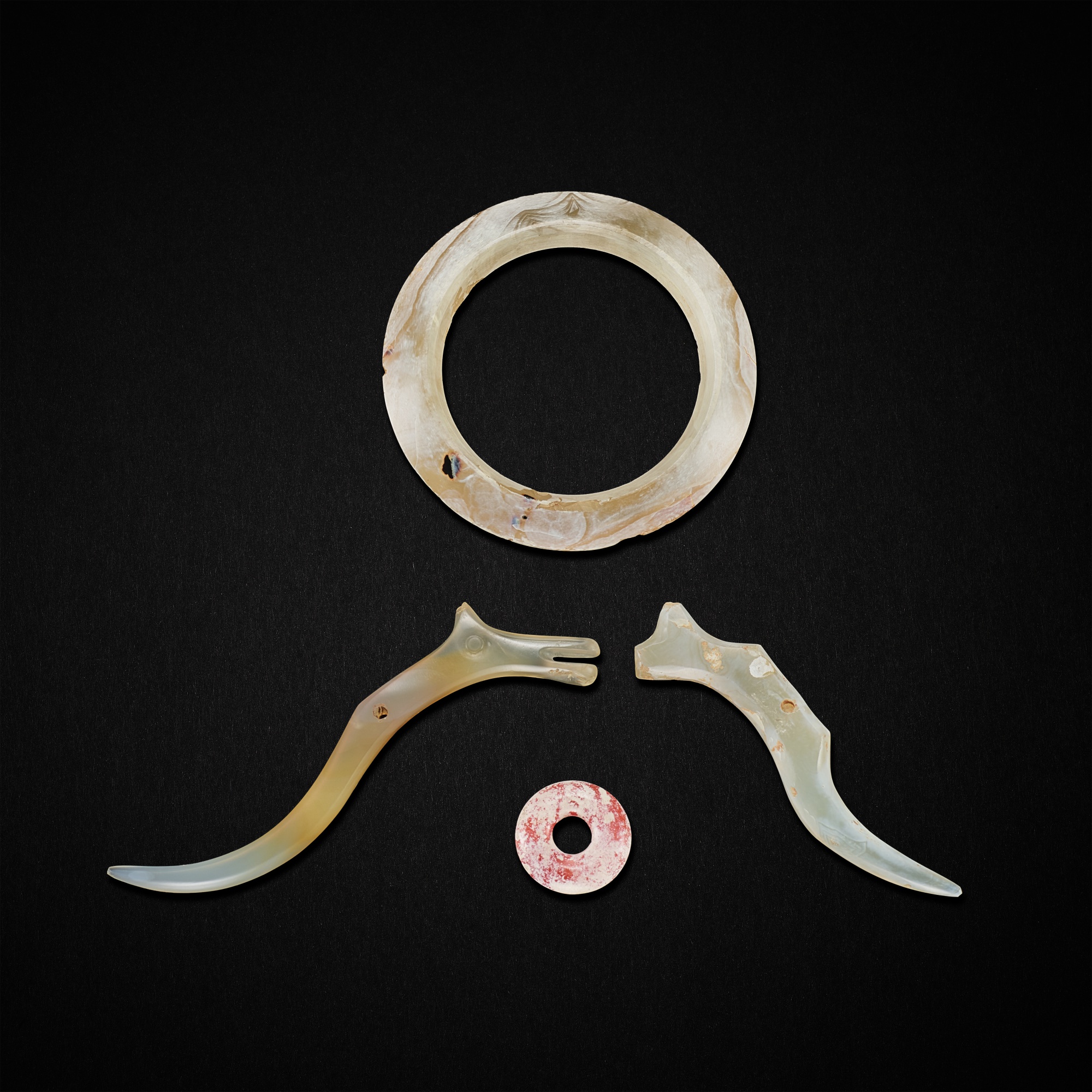 Two archaic agate rings and two archaic agate pendants, Eastern Zhou ...