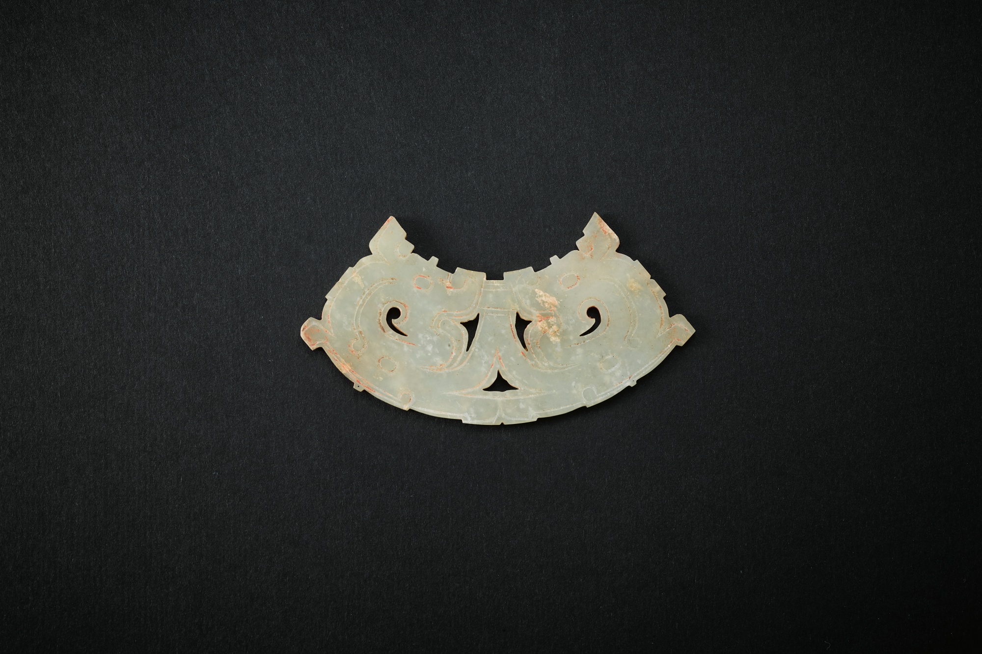 A pale grey jade openwork 'dragons' pendant, huang, Late Western Zhou ...