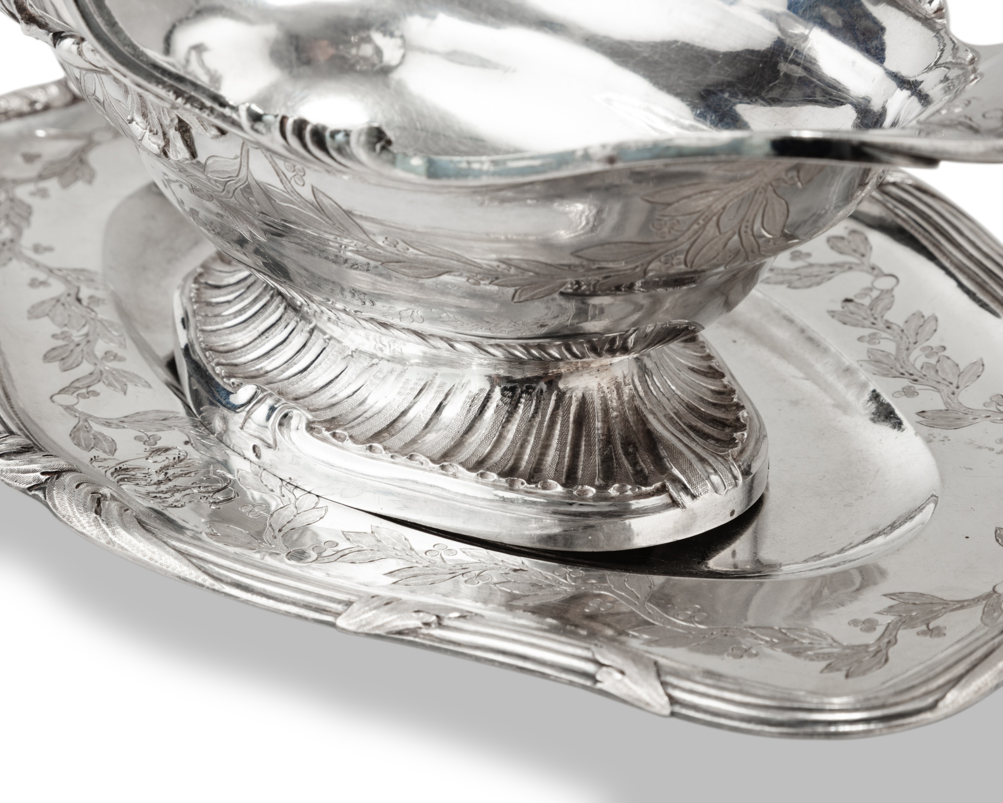 A silver sauce-boat and matching silver stand, the sauce-boat, Pierre ...