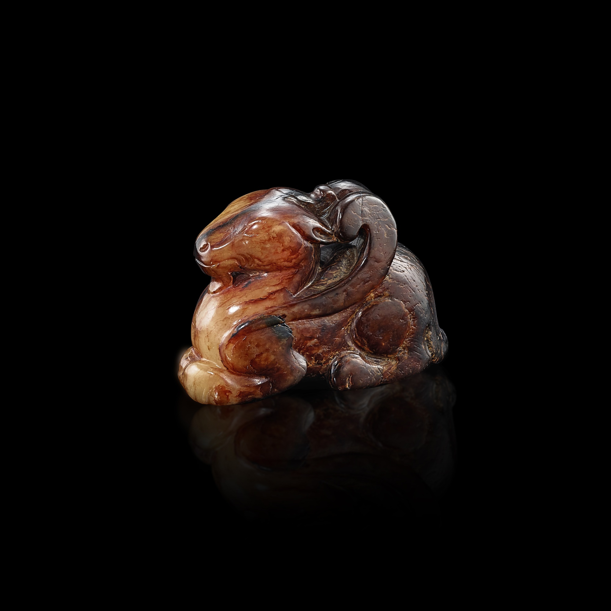 A white and brown jade mythical animal, Ming dynasty or earlier 明或更早 ...