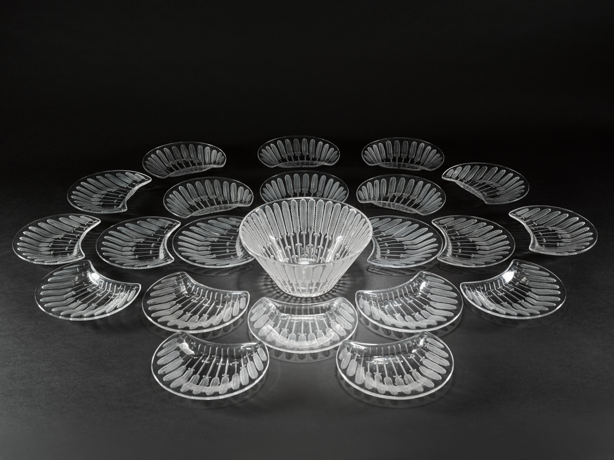 A set of twenty-one Lalique 'Jaffa' glass serving dishes and a bowl ...