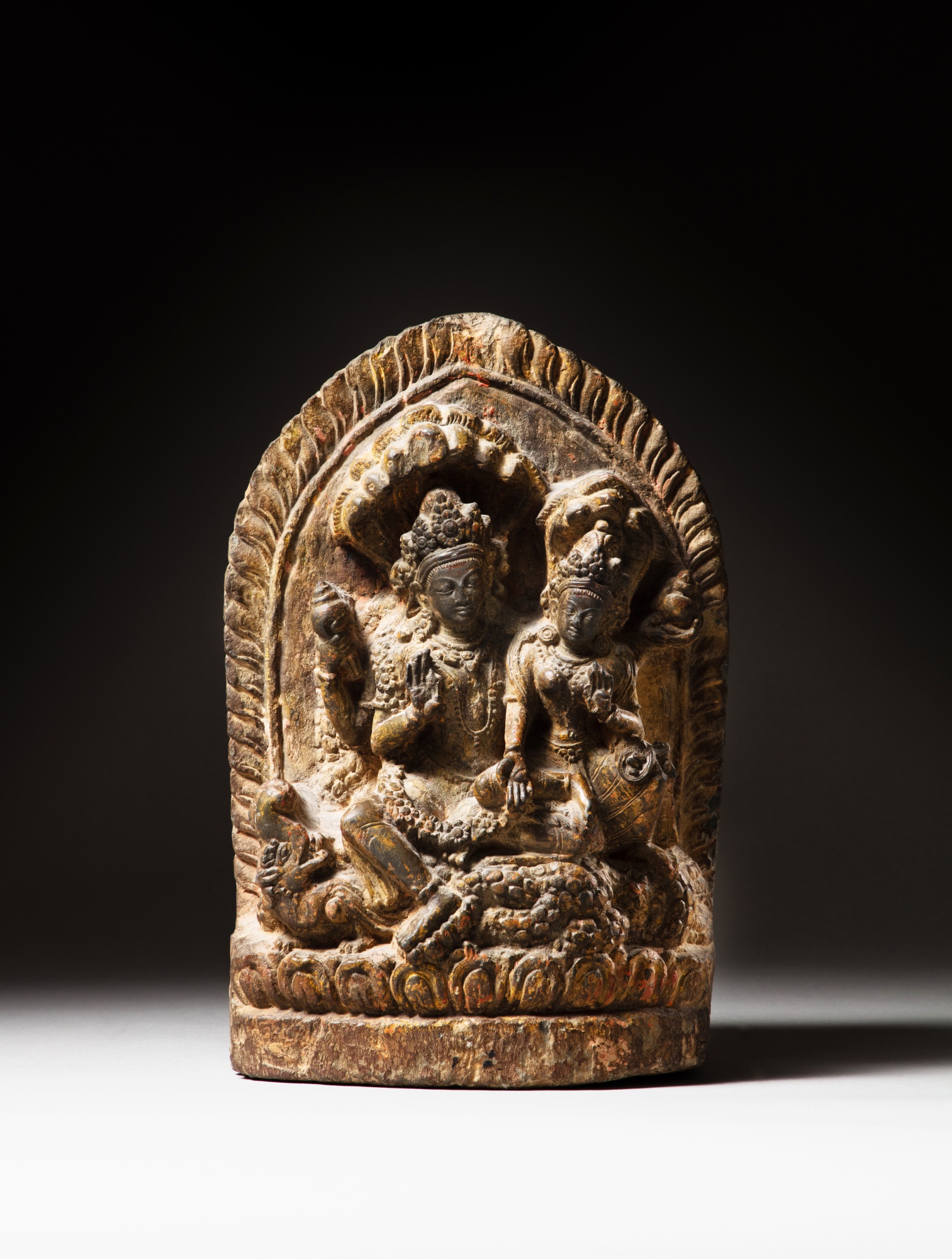A stone seated figure of Varuni and Varuna, Nepal, ca. 17th century ...