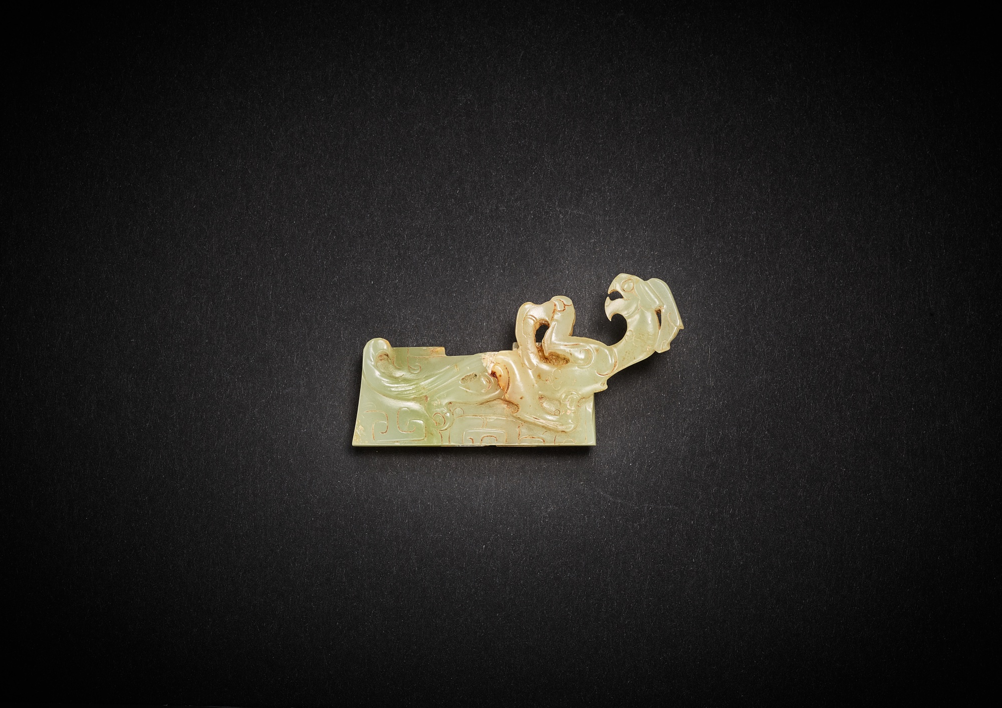 A celadon jade 'dragon' sword guard, Han dynasty | 漢 青白玉劍格 | Important ...