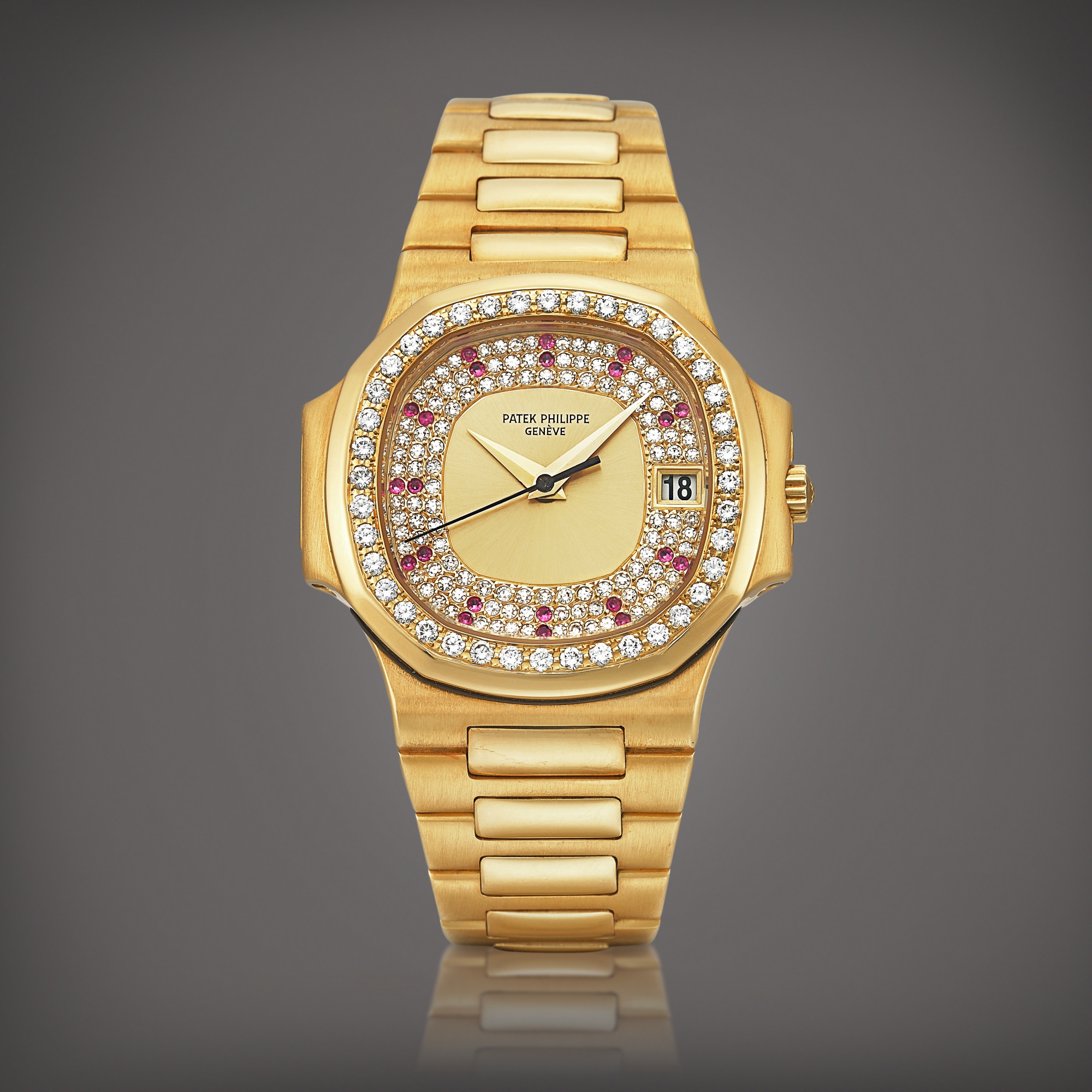 Nautilus, Reference 3800 | A yellow gold, diamond and ruby-set bracelet ...