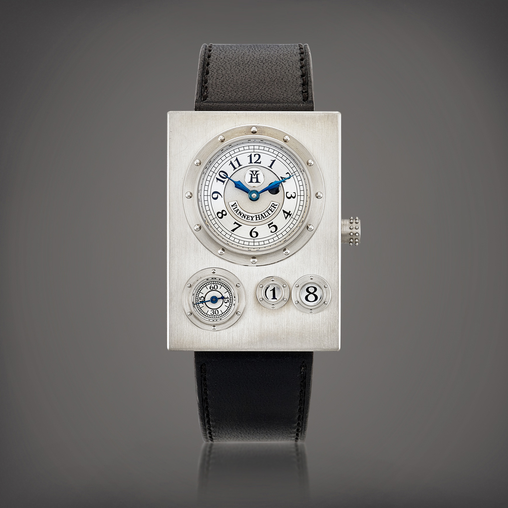 Trio Grande Date | A white gold wristwatch with double date apertures ...
