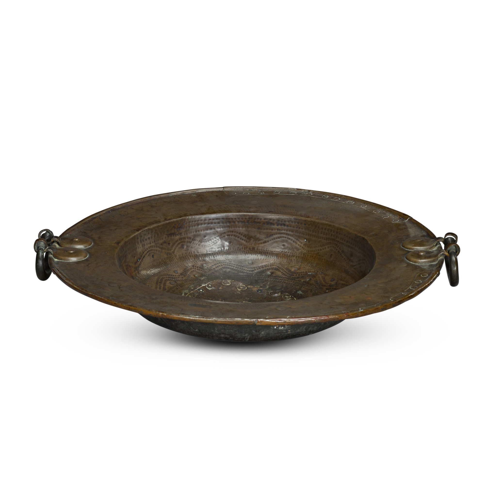 A large hammered brass twin-handled brazier, 17th century, possibly ...