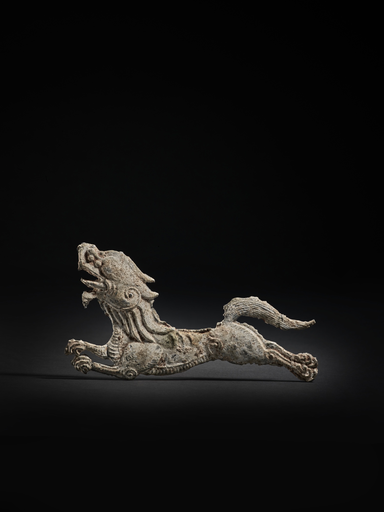 An exceedingly rare lead 'mythical beast' ornament plaque, Tang dynasty ...