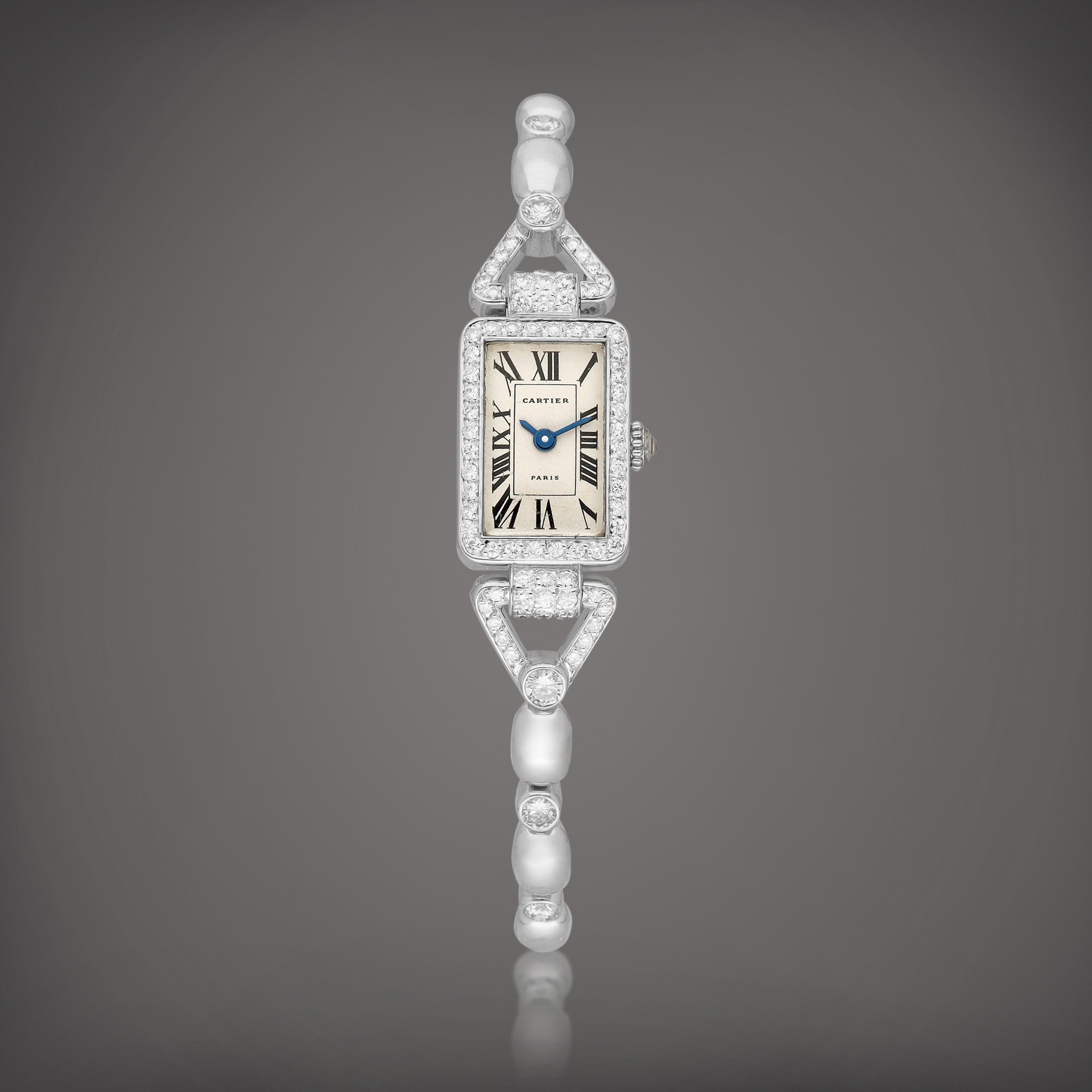 A white gold and diamond-set bracelet watch, Circa 2004 卡地亞 | 白金鑲鑽石鏈帶腕錶 ...